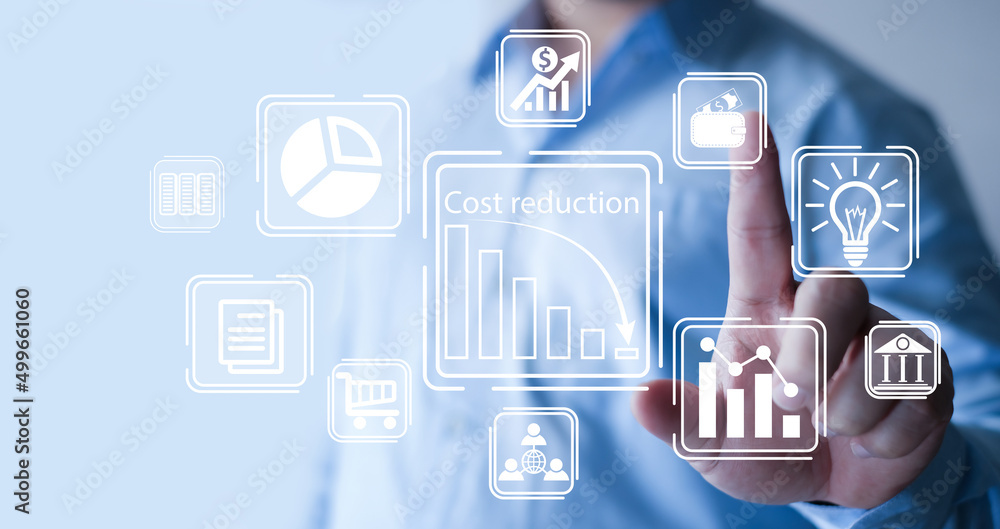 Cost reduction Concept. Businessman with his hand lowers the arrow of ...