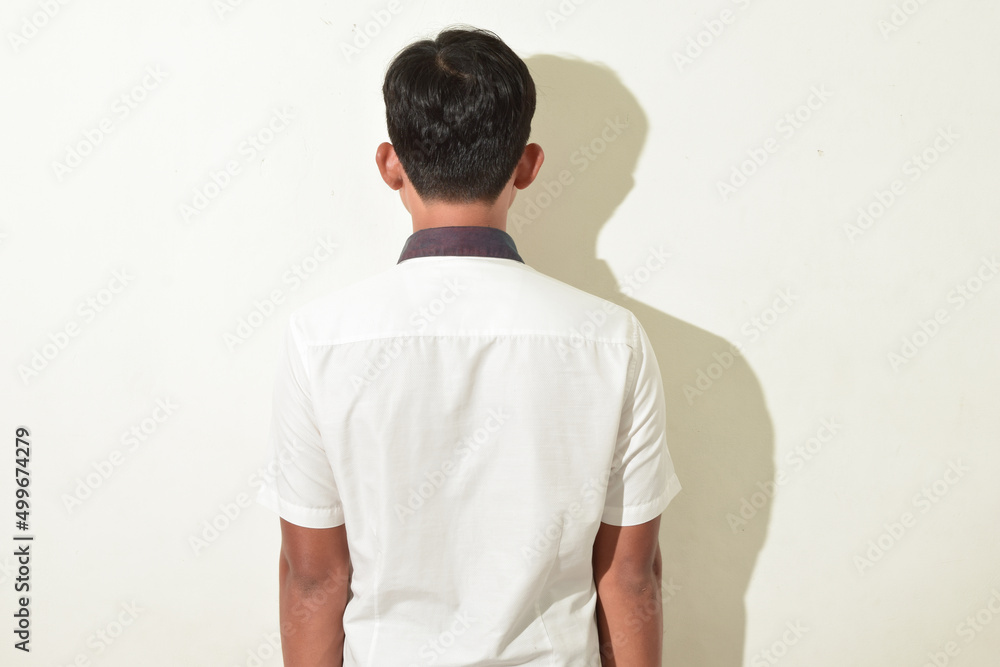 asian man rear view. Indonesian man poses with his back to the camera ...