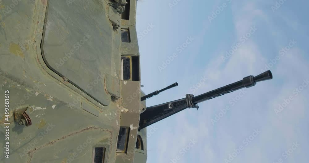 Coaxial machine gun on the turret of an armored vehicle during a ...