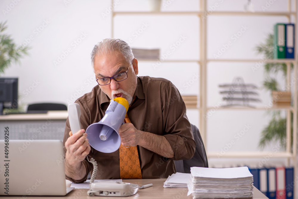 Angry boss employee holding megaphone at workplace Stock Photo | Adobe ...