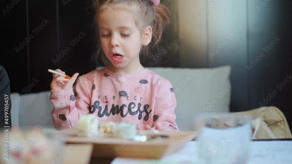 Vídeo do Stock: Child eat sashimi in restaurant. Middle shoot little ...