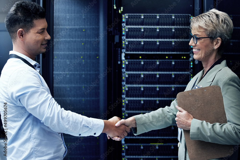 Always a pleasure programming with you. Shot of two technicians shaking ...