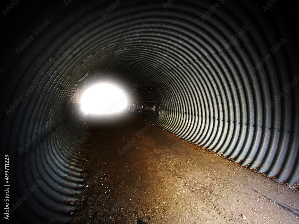 dark scary deep underground tunnel light steel corrugated walls echo ...