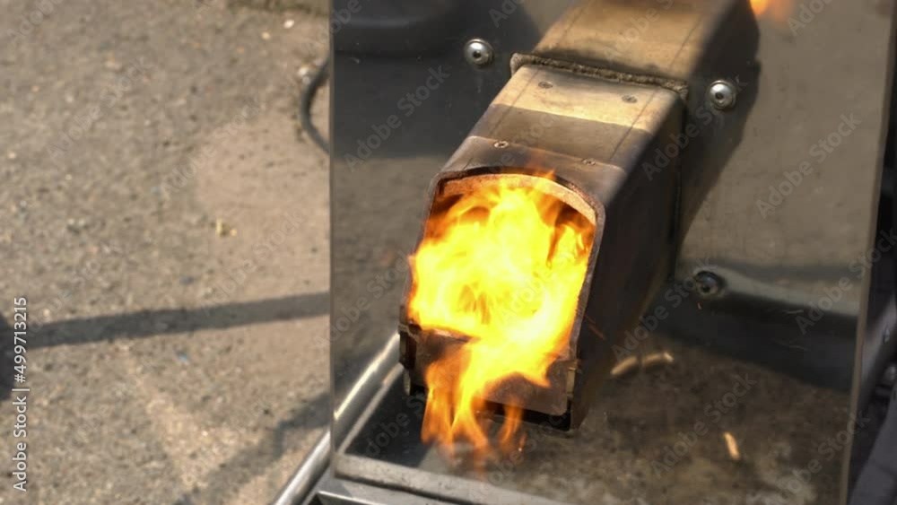A tube with a breathing fire. Blacksmith's furnace for heating metal ...