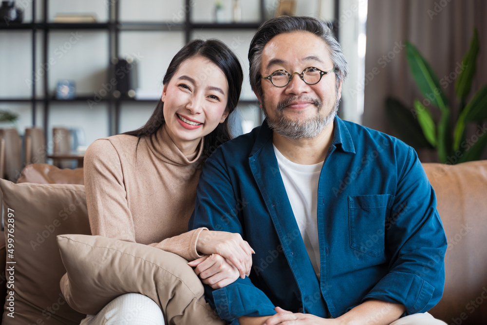 Asian Middle-aged Asian couple smiling at the camera. Family couple ...