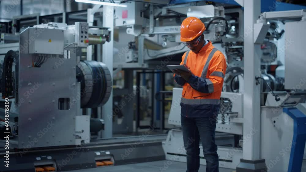 Engineer use tablet computer at industrial factory closeup. Supervisor ...