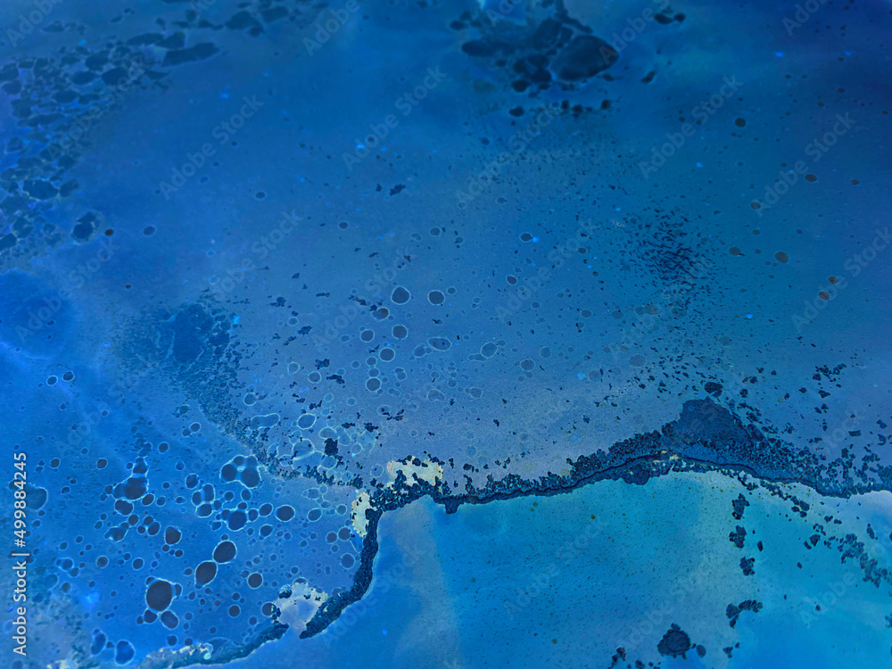 Abstract blue background with beautiful smudges and stains made with ...