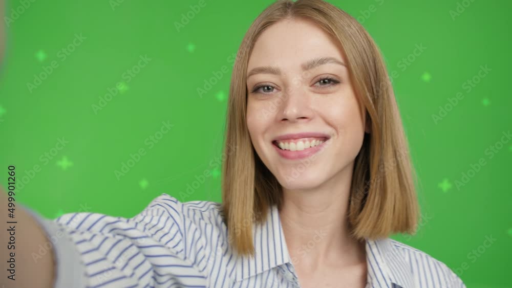 Young woman teenager speaking on video call, vlogger using smartphone ...