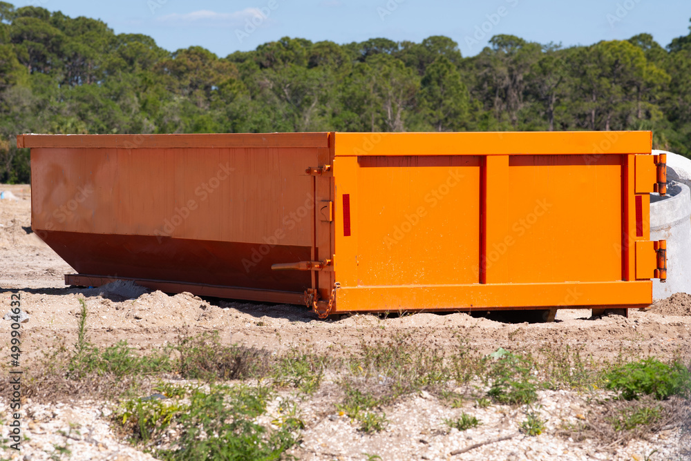 Full construction rubbish bin with loads at construction site waste ...