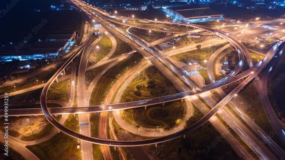 Time lapse aerial view of highway junctions with roundabout. Bridge ...