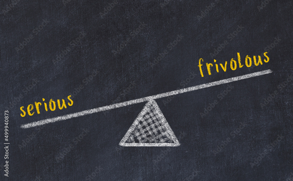Chalk drawing of scales with words serious and frivolous. Concept of ...