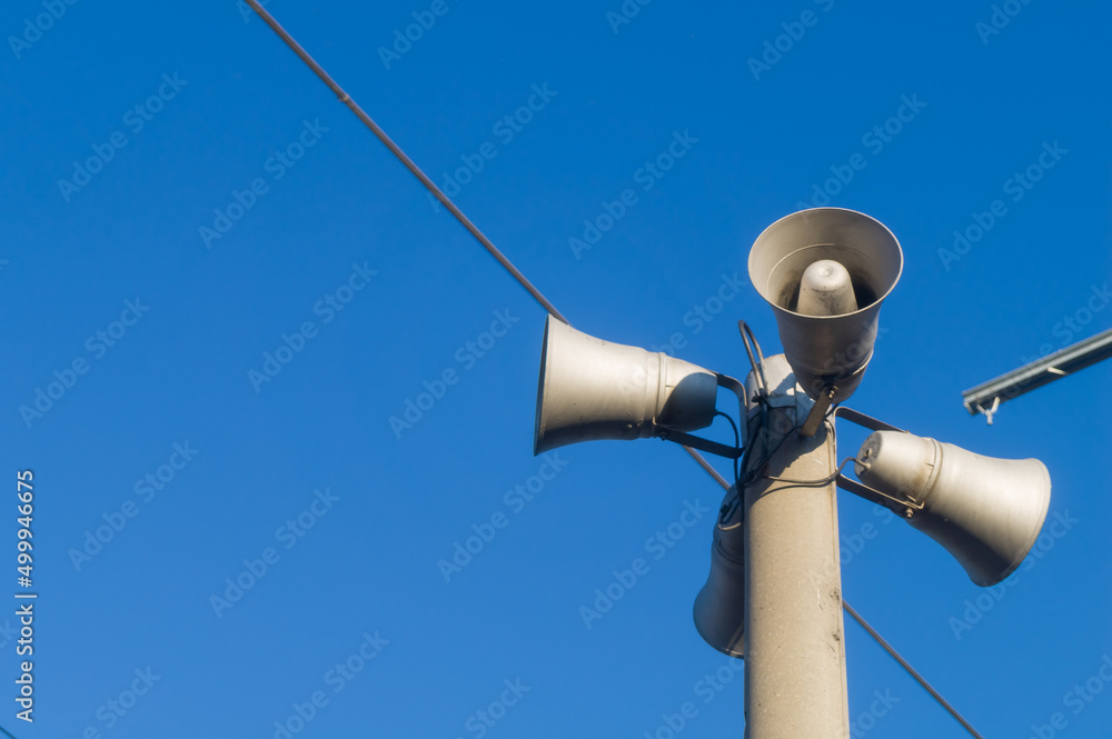 Public address system on the pole. Loudspeakers alerting the public ...