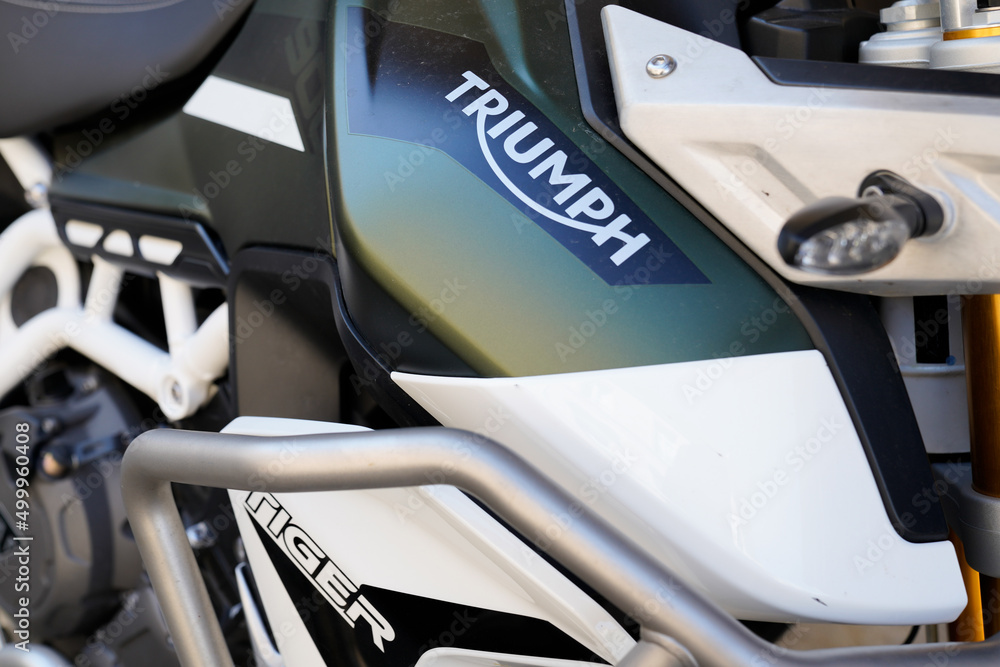 triumph tiger motorcycle detail sign text and brand logo on fuel tank ...