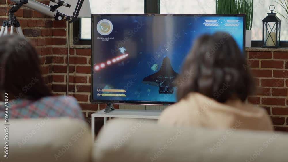 Vidéo Stock Cheerful people playing online video games on console ...