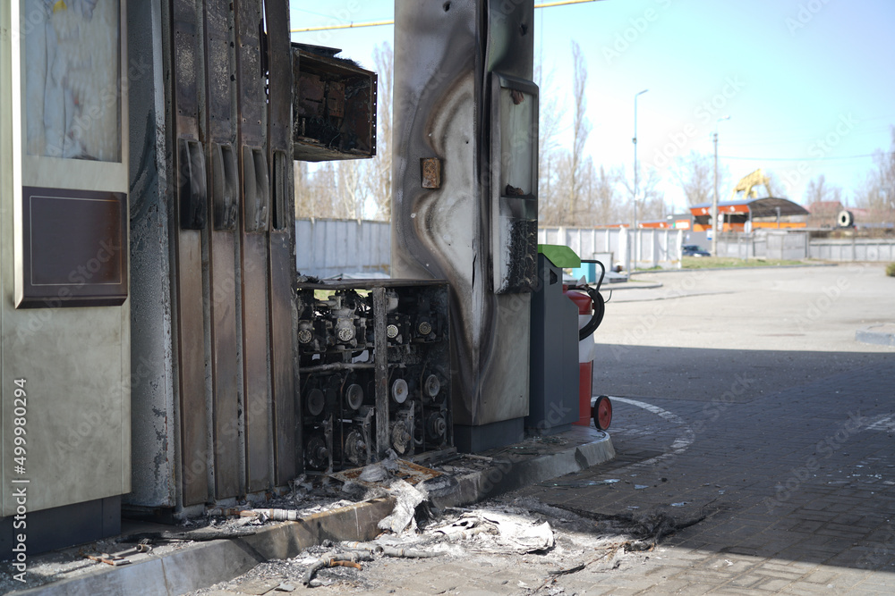 Gas station with a broken station from a shell explosion. Exploded gas ...