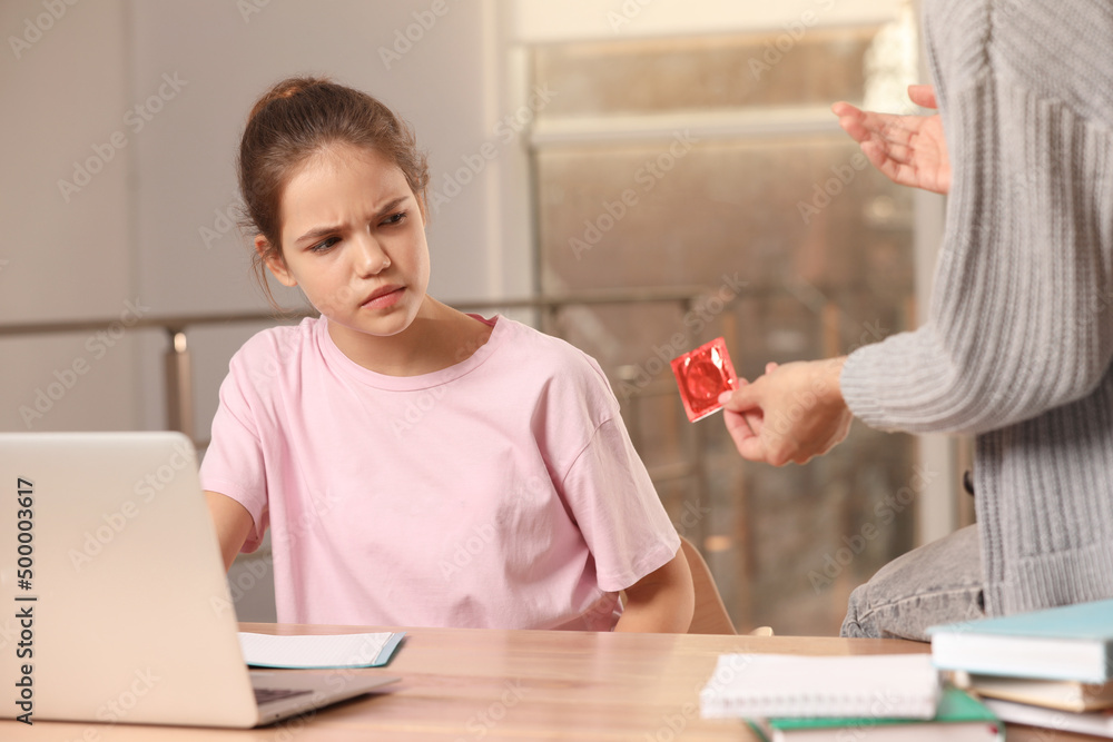 Mother Talking With Her Teenage Daughter About Contraception While She