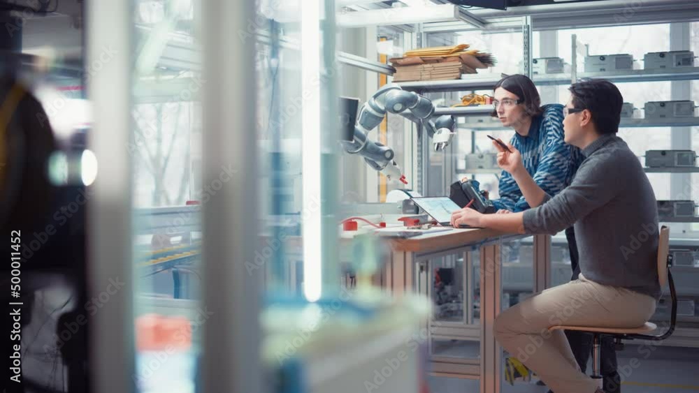 Two Diverse Developers Brainstorming while Coding at Laptop. Caucasian ...