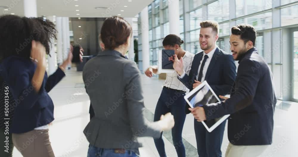 Grooving to one success after another. Excited happy diverse ...