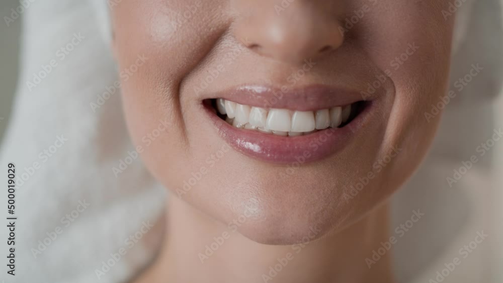 Close up video of woman showing full smile. Shot with RED helium camera ...