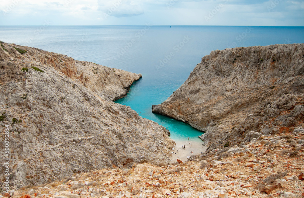 Bay with Seitan Limania beach among rocks with azure water, Crete ...