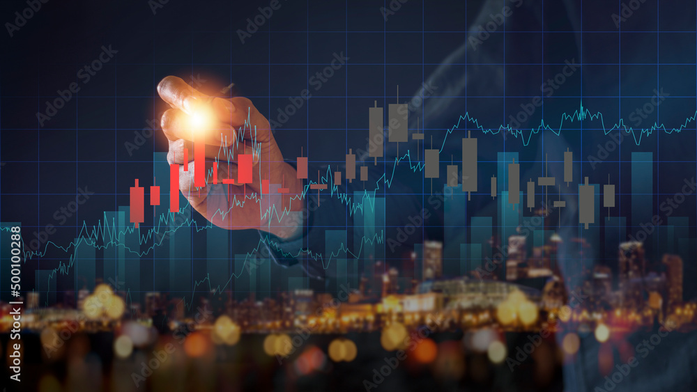 Businessman writing analyze graph for trade stock market on the screen ...