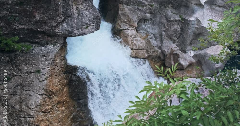 Natural mountain waterfall in rock canyon in summer green forest. Wild ...