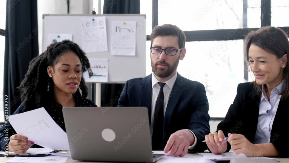 Business partners working together on a project. Multiracial colleagues ...