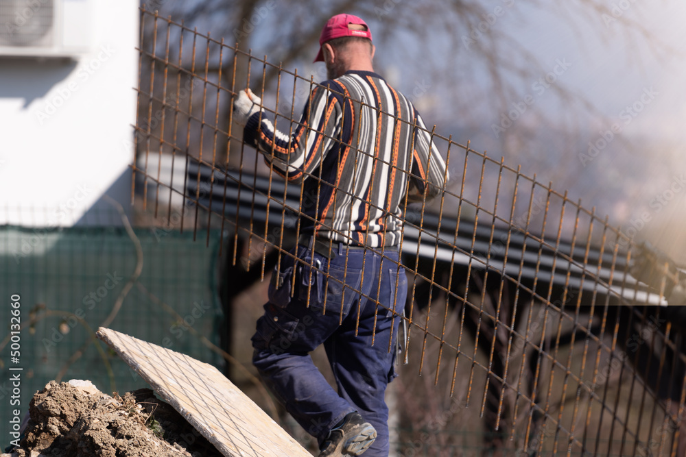 Construction workers fabricating steel reinforcement bar at the ...