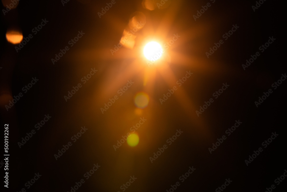 Solar lens flare on black background Stock Photo | Adobe Stock