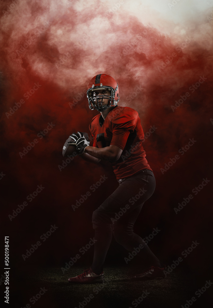 Red sky. Creative portrait of young man, american football player at ...