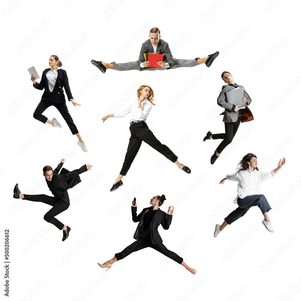 Young office workers jumping and dancing in busness style clothes or ...