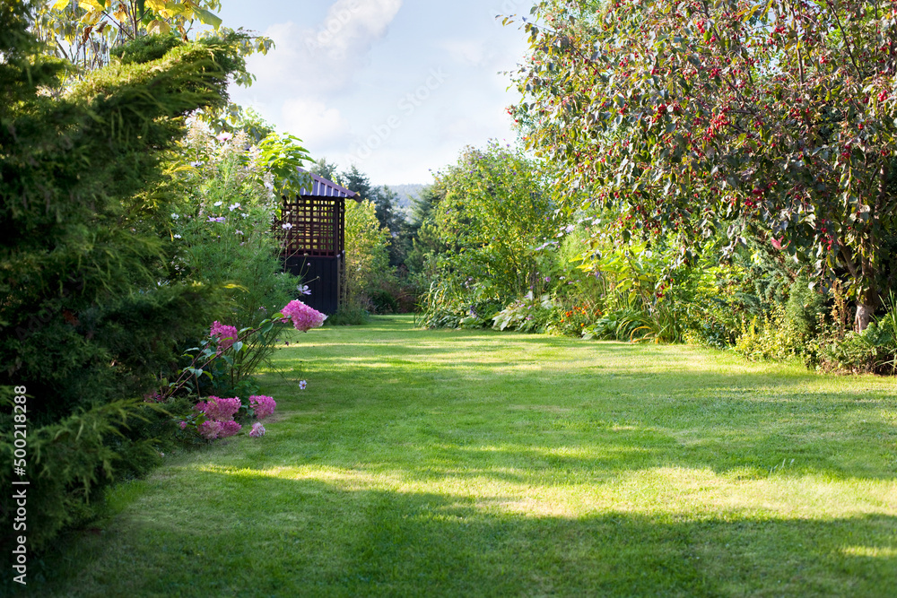 Summer house in the beautiful backyard green garden landscape and fresh ...