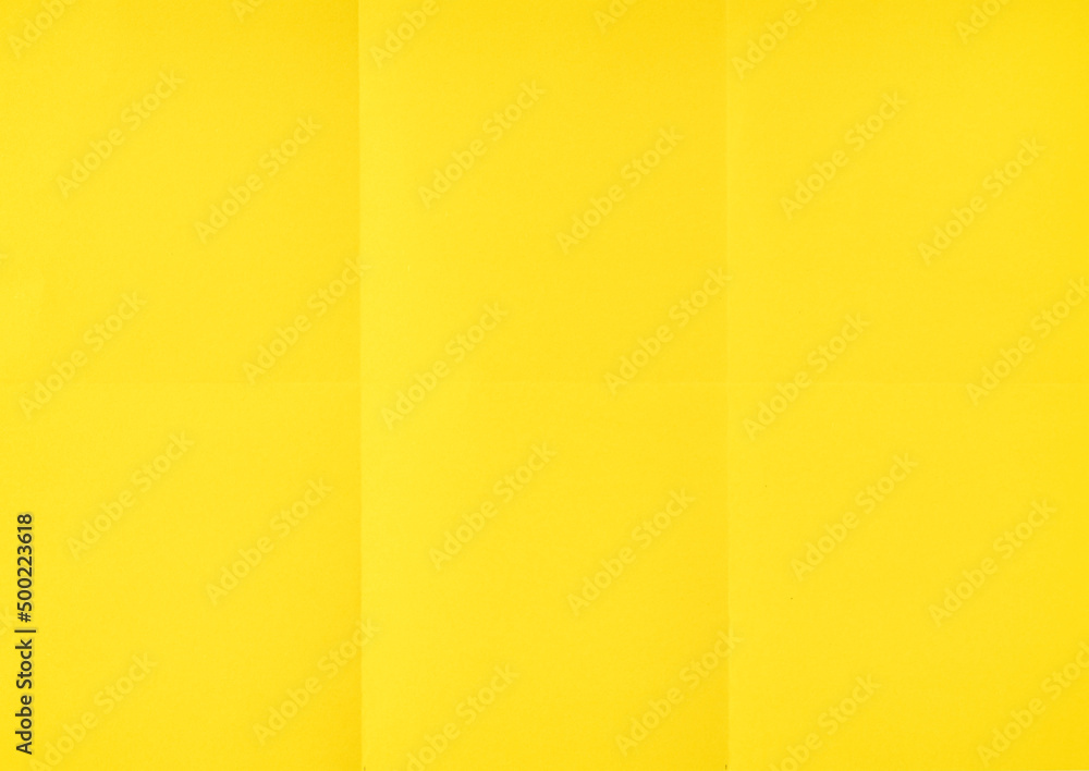 Yellow crumpled unfolded paper sheet texture background. Paper folded ...