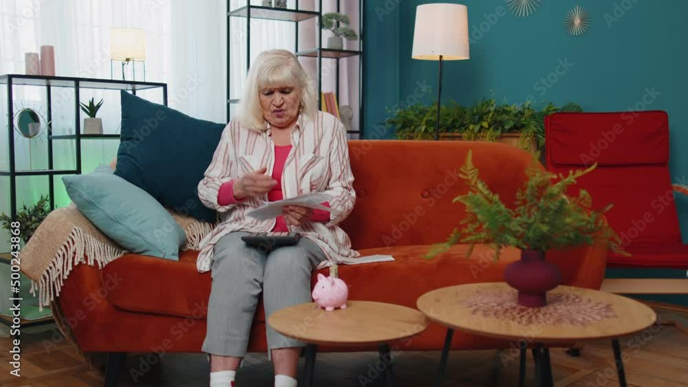 Poor granny checking analyzing domestic financial bills. Crisis ...