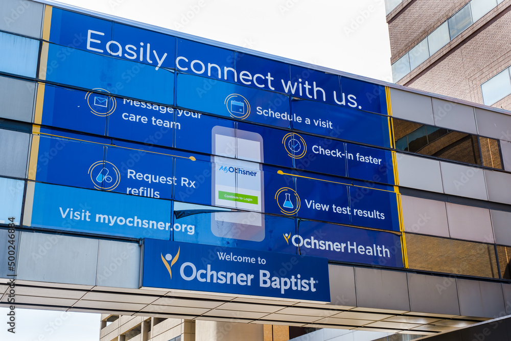 Sign with information about hospital app on breezeway of Ochsner ...
