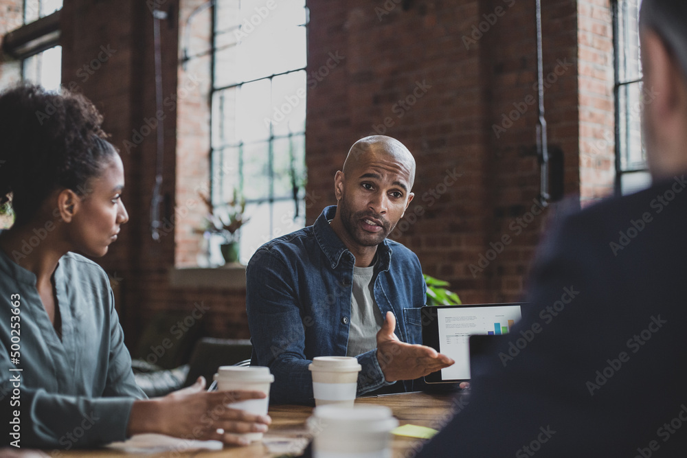 African American businessman presenting to clients Stock Photo | Adobe ...