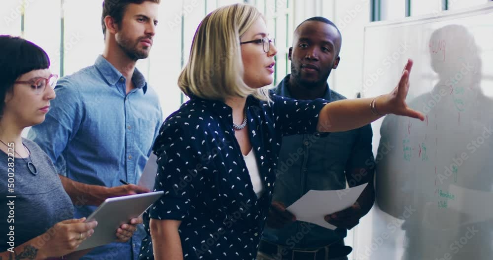 Bringing their ideas to life. 4K video footage of a diverse group ...