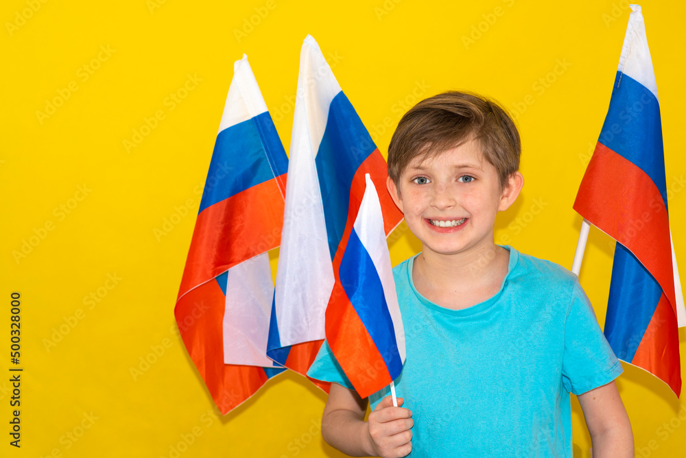happy smiling boy holding russian flag. schoolboy with russian flags ...