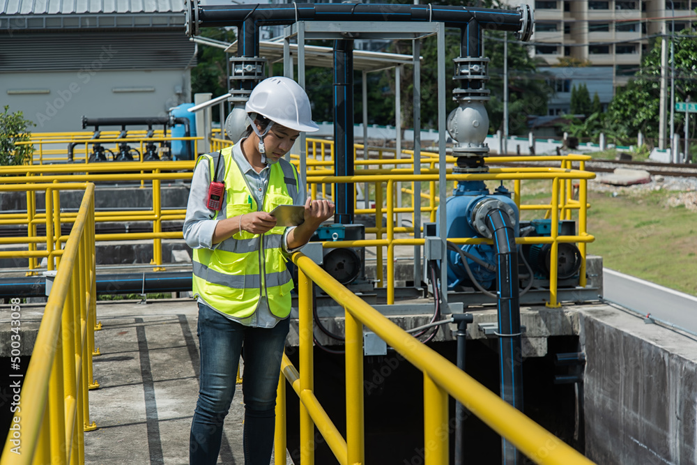 Foto de Wastewater treatment concept. Service woman engineer on waste ...