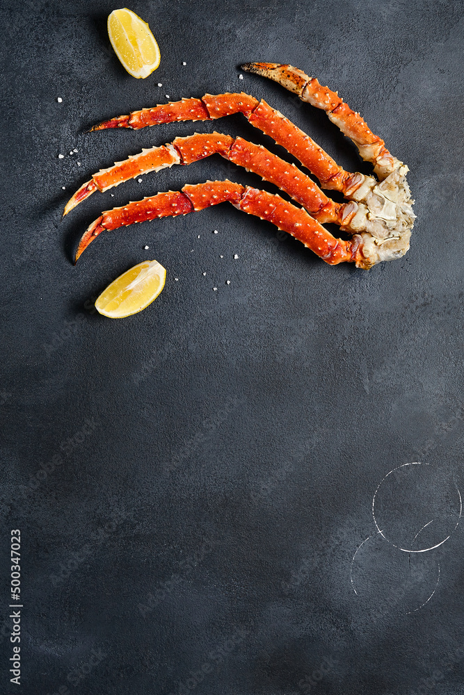 Crab legs top view on dark background. Delicatessen crab seafood on ...