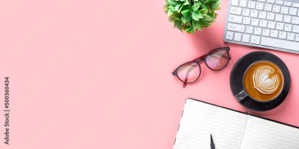 Office desk with keyboard computer, Pen, eyeglass, notebook, Cup of ...