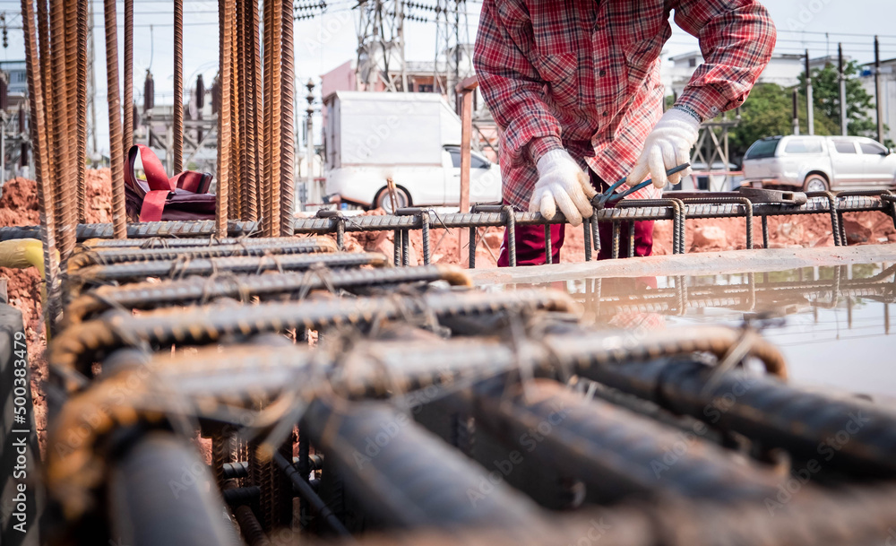 Construction workers fabricating steel reinforcement bar at the ...