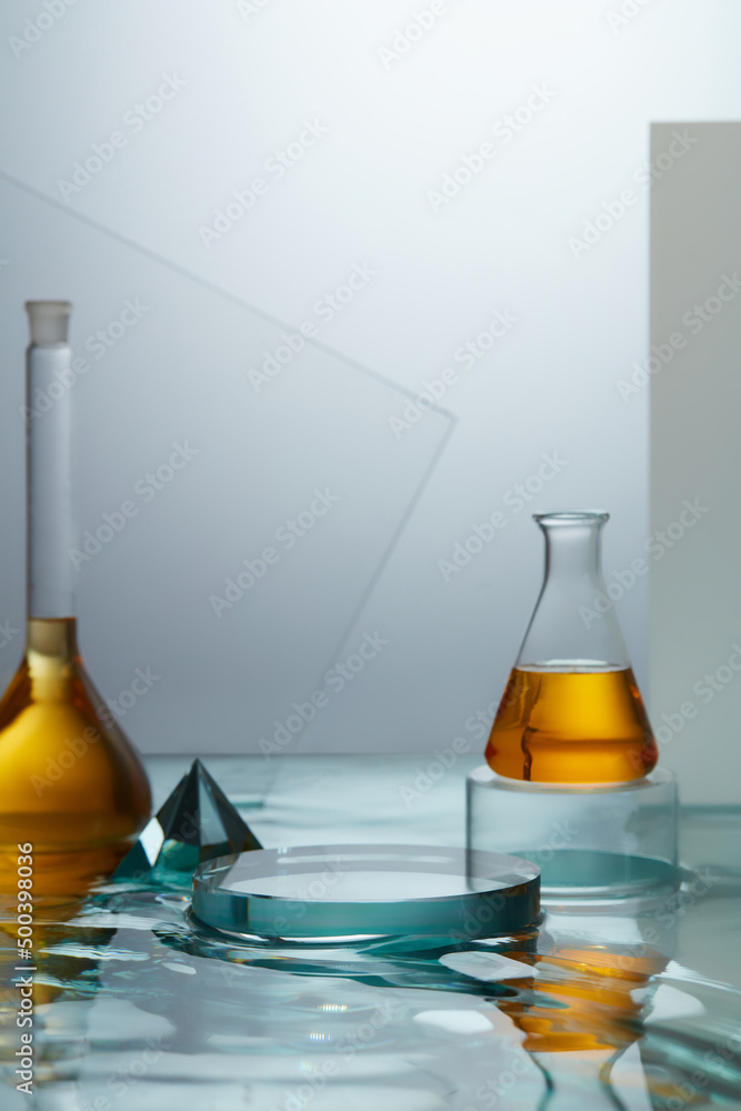 Front view of transparent podium and yellow water in laboratory ...