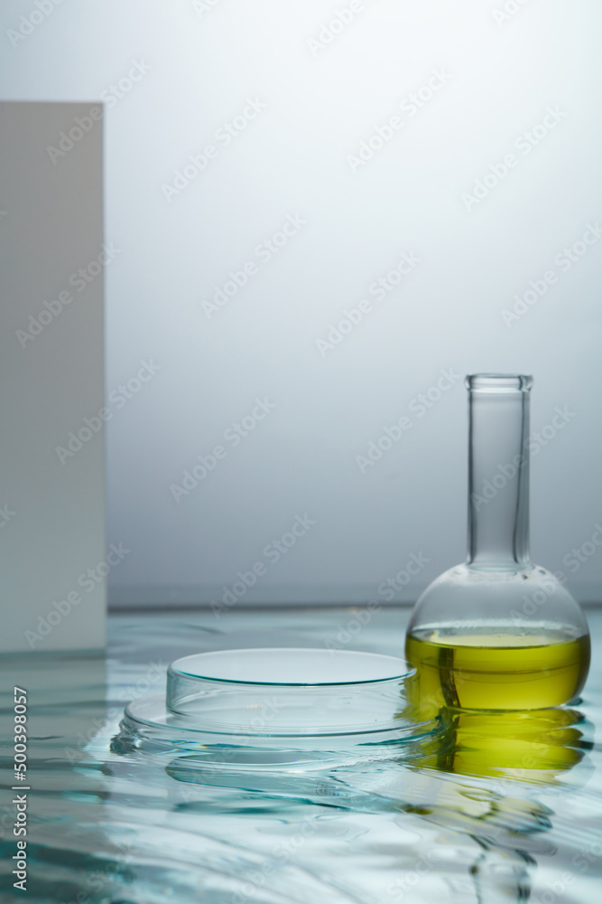 Front view of transparent podium and yellow water in laboratory ...