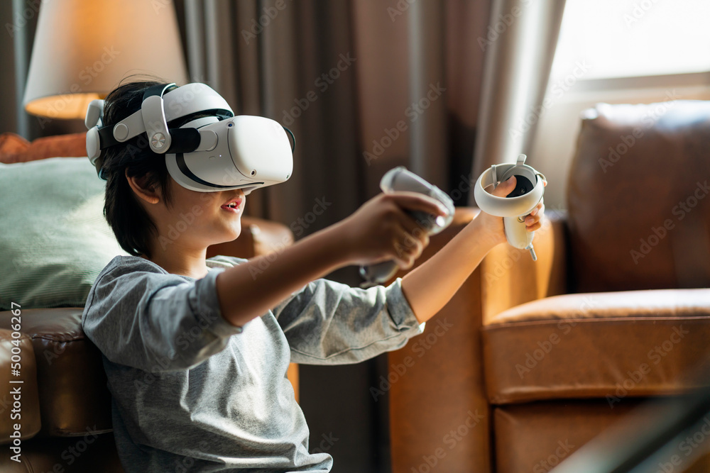 exiting asian child male boy enjoy metaverse gaming with wearable vr ...
