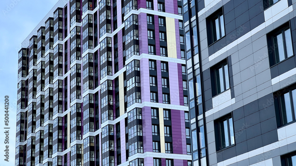 The facade of the building in purple,geometric patterns from windows ...