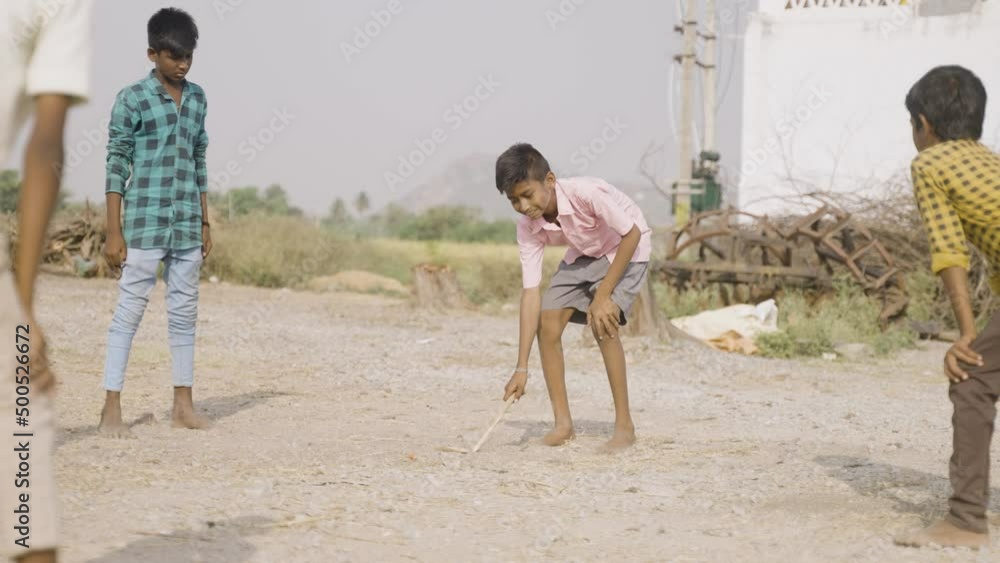 Group of village kids playing gilli danda game at rural India - concept ...