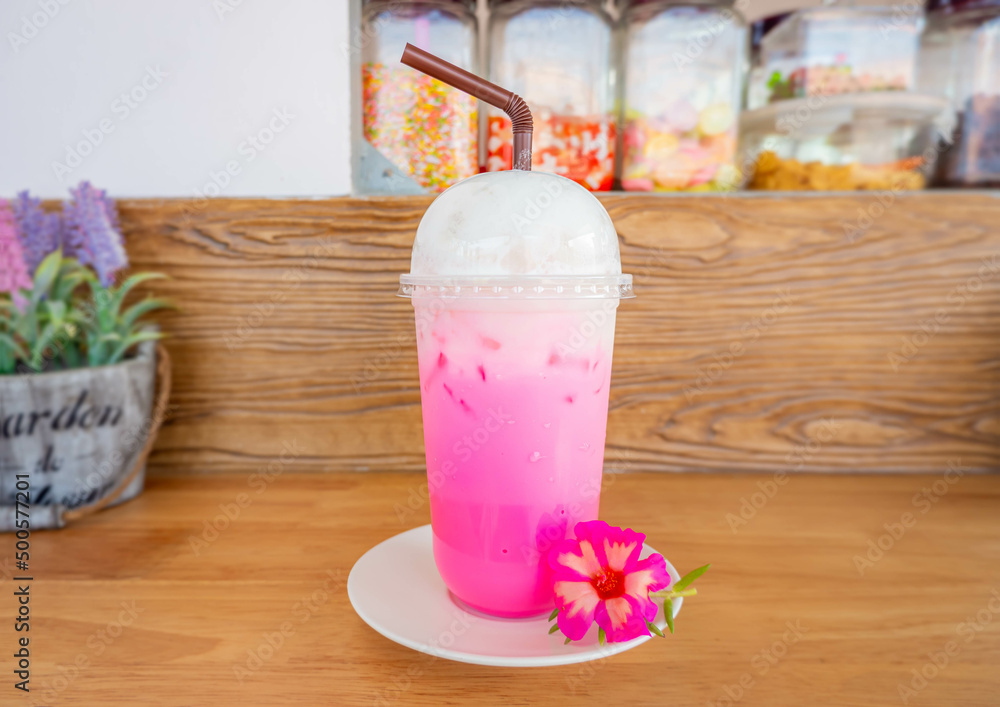 Iced pink milk favorite drink in Thailand. Sweet drink red sugar syrup ...