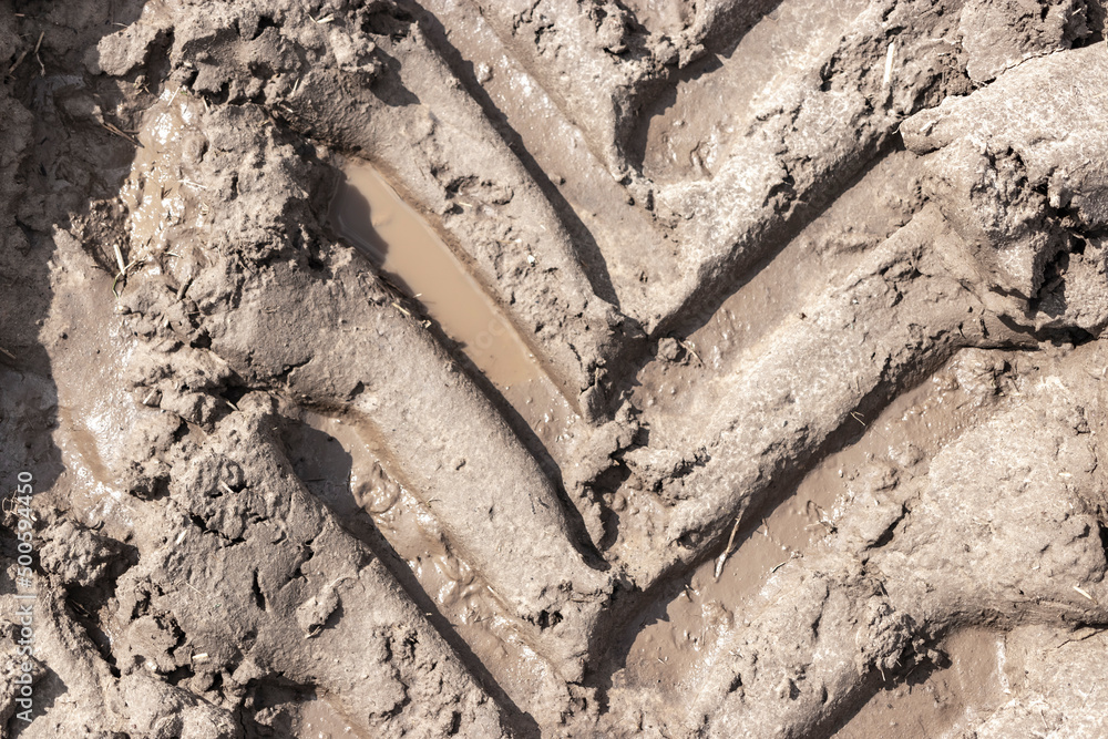 Footprint of wheel tread on the ground road. The trail from the tread ...