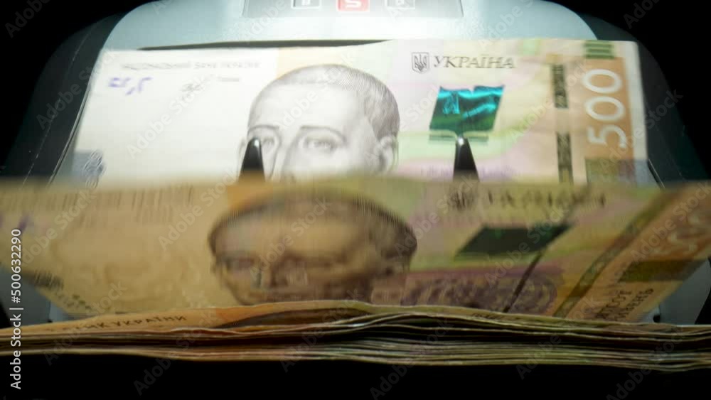 Counting machine for banknotes. Ukrainian money in a calculating ...